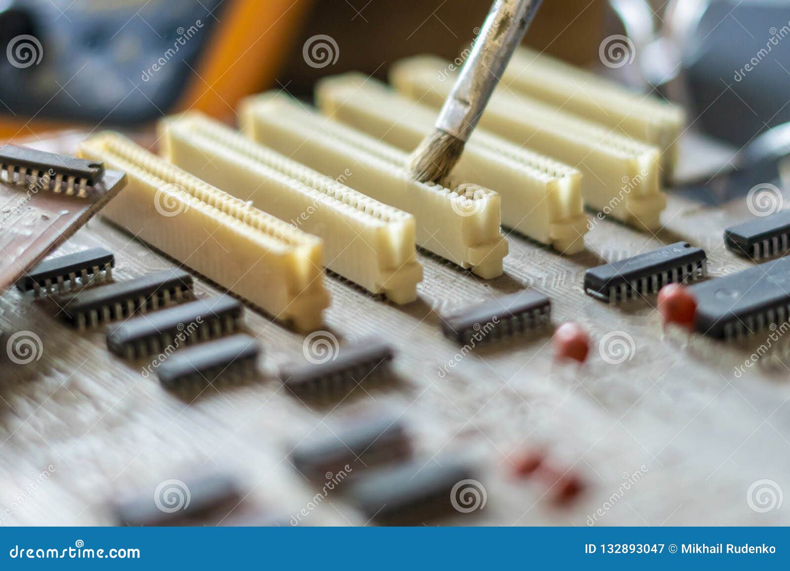 Engineer Removes Dirty Dust from the Computer Board Using a Brush F ...