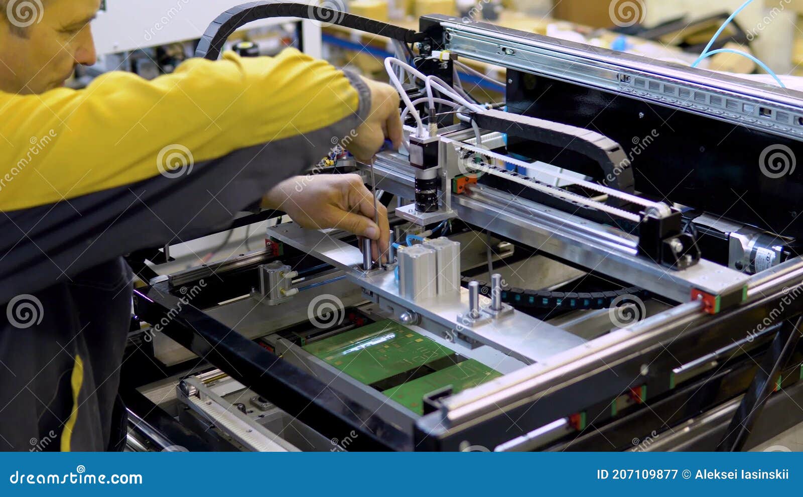 Engineer Removing Nozzle from Machine at Surface Mount Technology, Smt ...