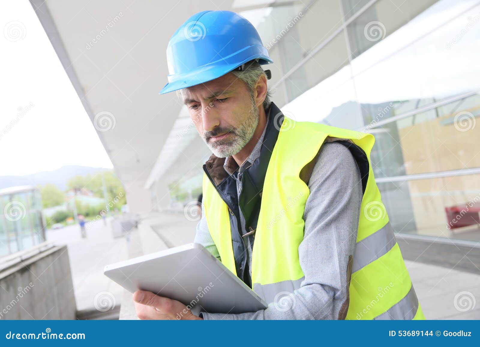 Engineer with Security Helmet Working on Tablet Stock Photo - Image of ...