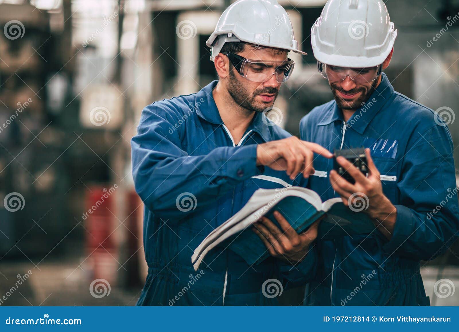 Engineer Service Team Looking at Machine Service Manual Text Book ...