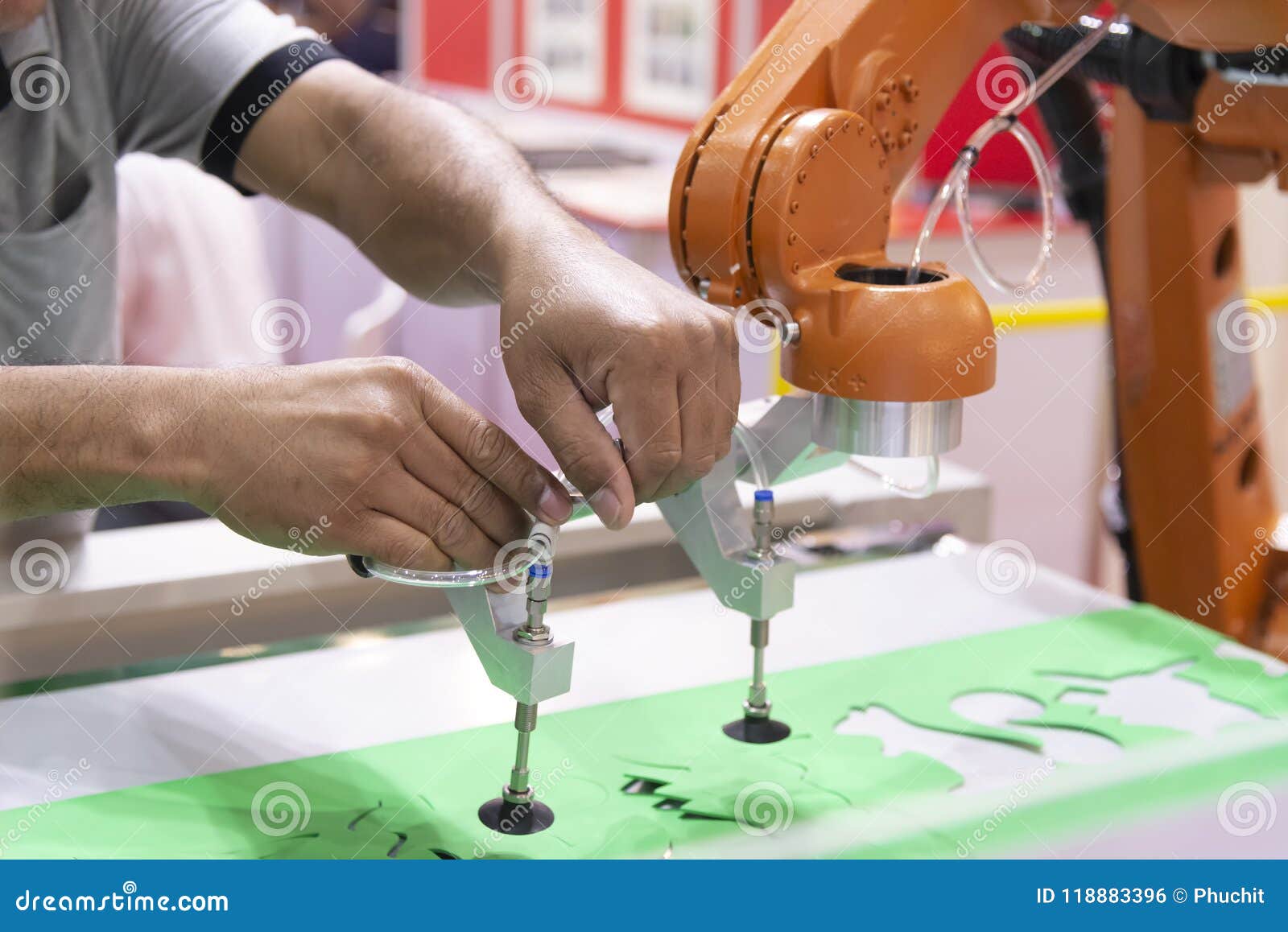 The Engineer Setup the Robot Arm in the Packaging Factory. Stock Photo ...