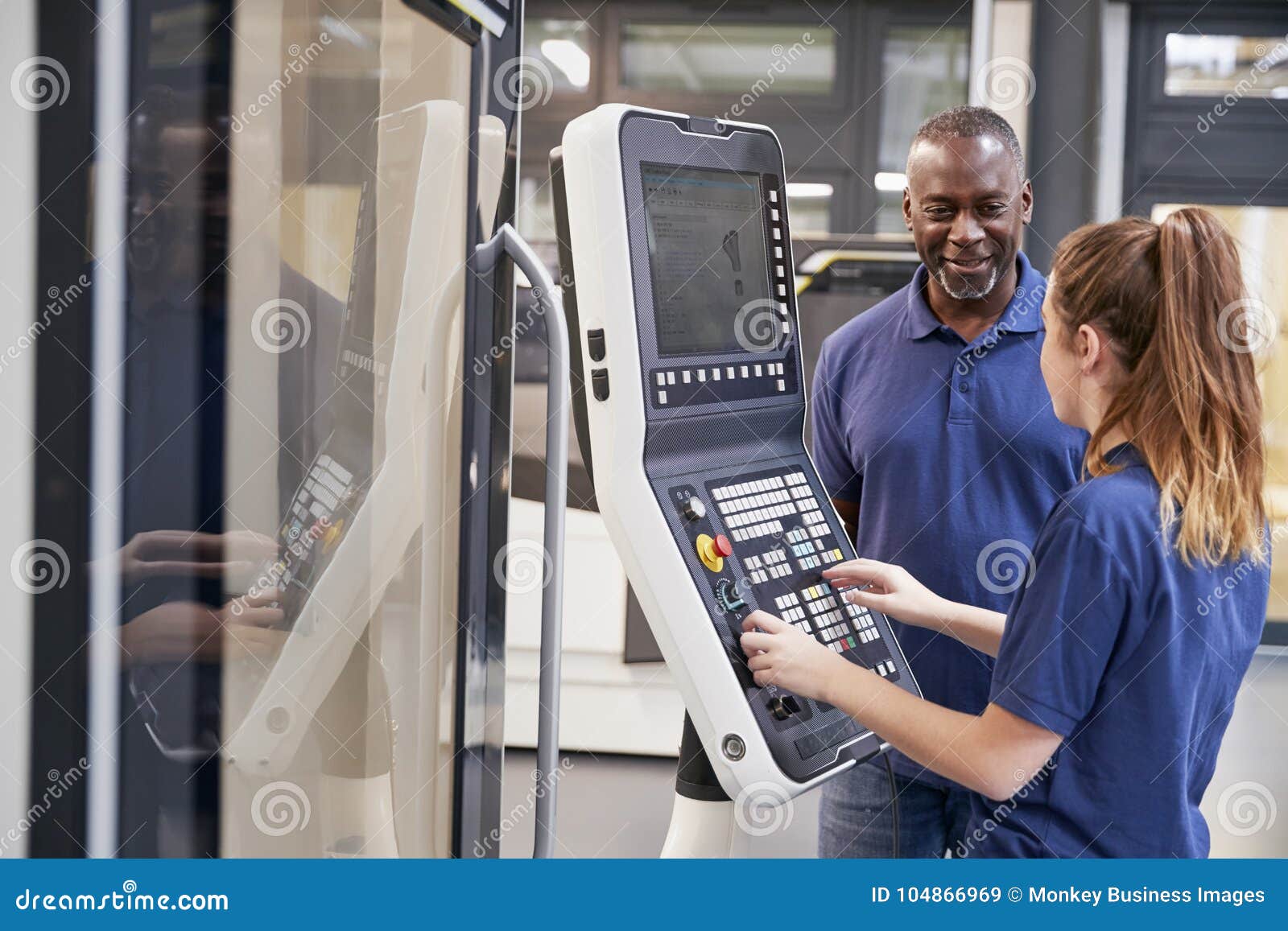 Engineer Showing Apprentice How To Use CNC Tool Making Machine ... Engineer Showing Apprentice How To Use CNC Tool Making Machine ...