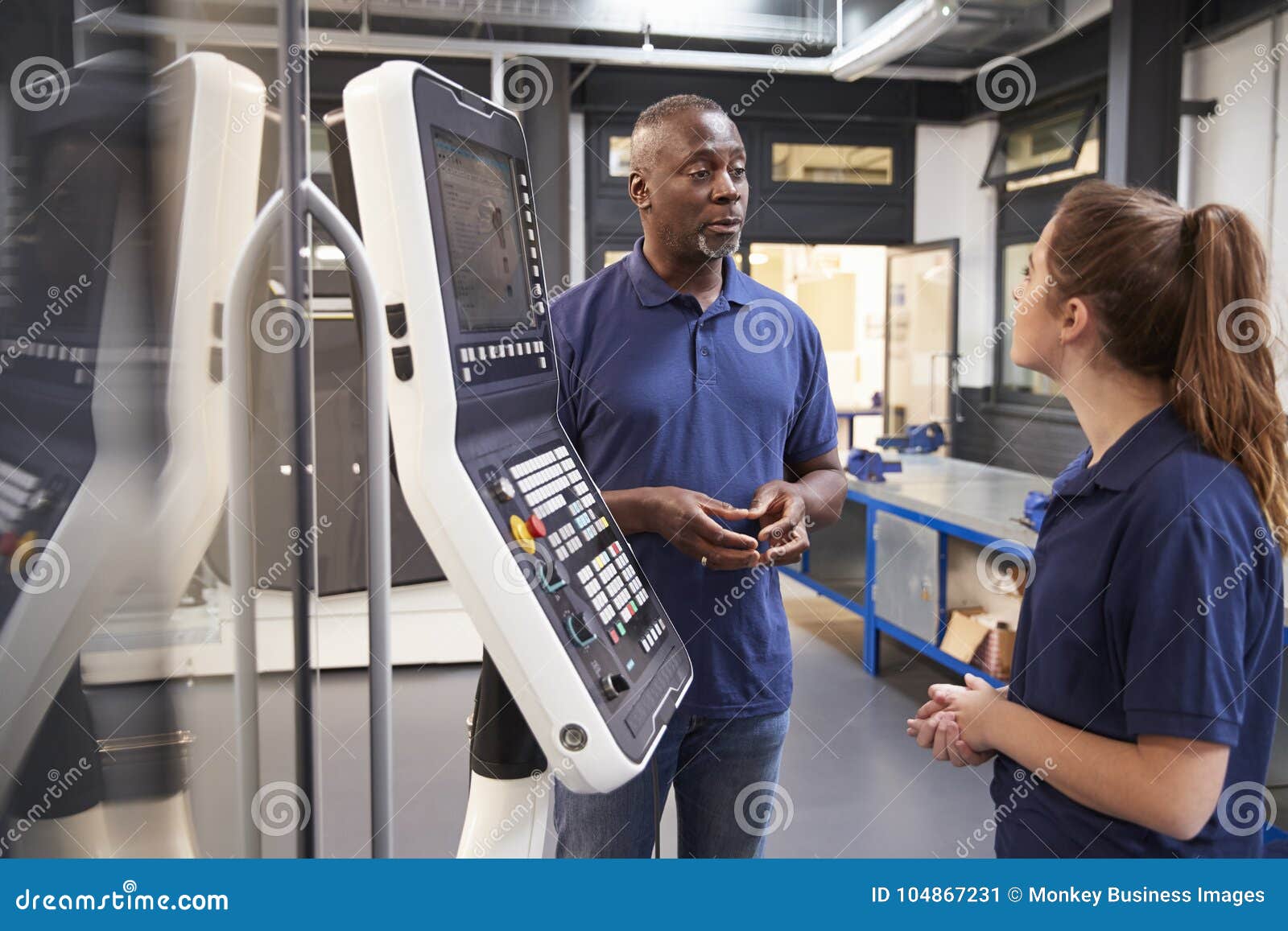 Engineer Showing Apprentice How To Use CNC Tool Making Machine Stock ... Engineer Showing Apprentice How To Use CNC Tool Making Machine Stock ...
