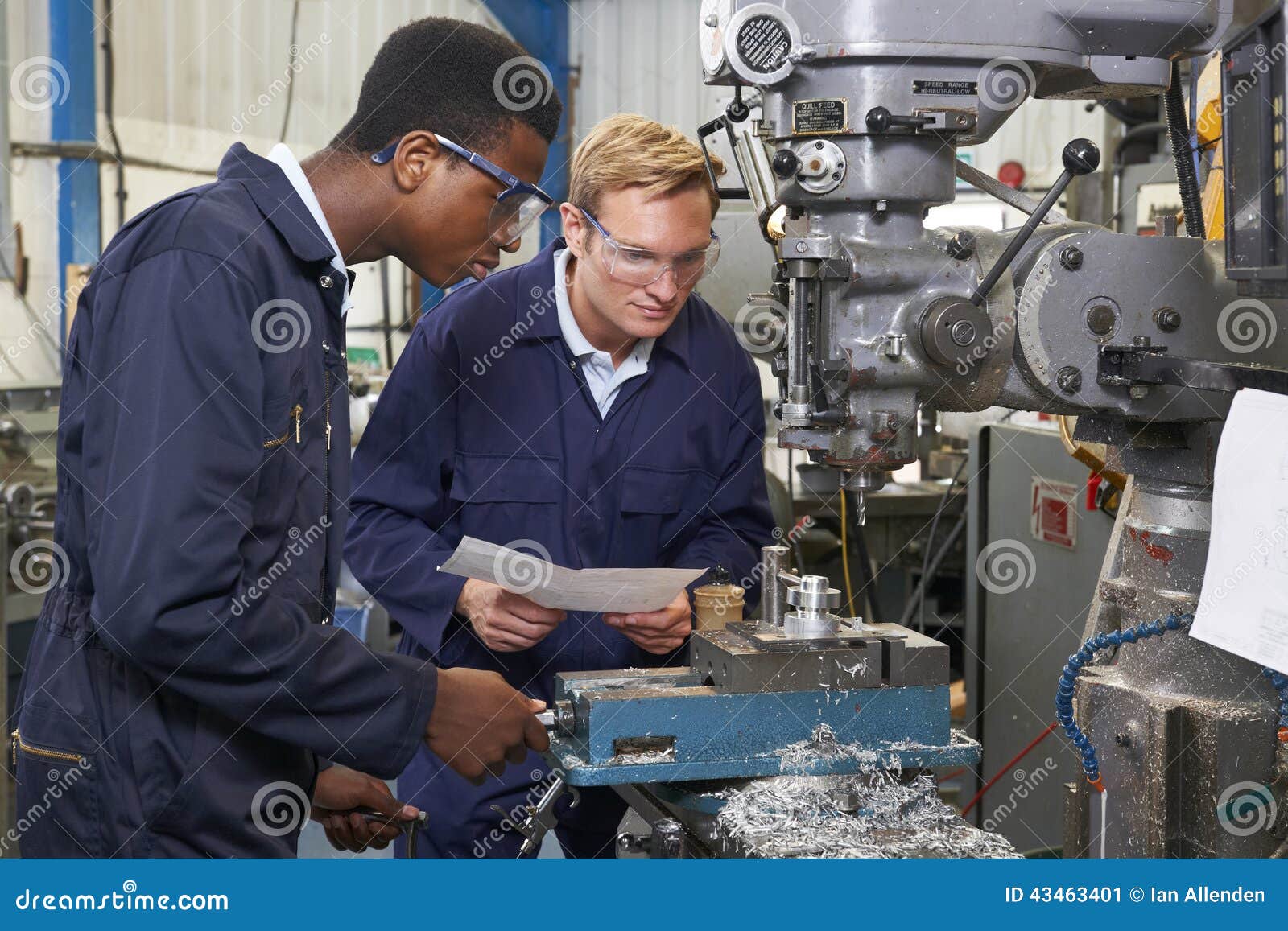 Engineer Showing Apprentice How To Use Drill in Factory Stock Image ...