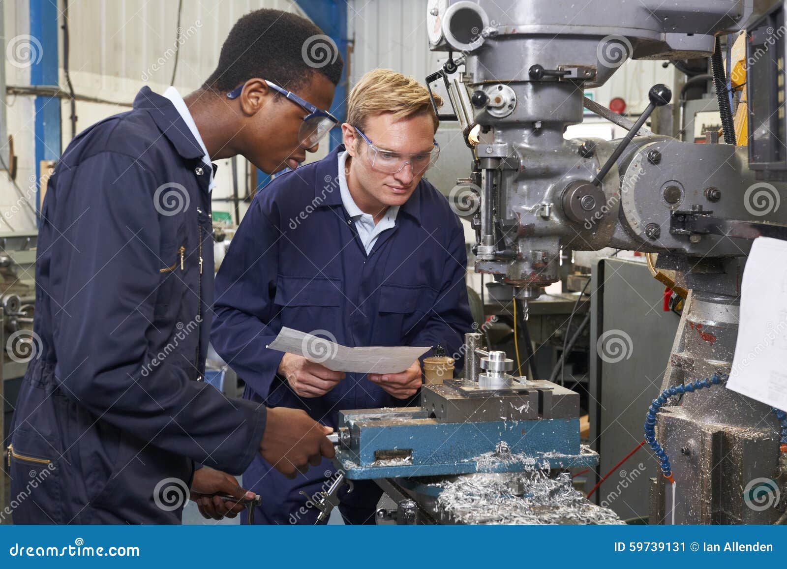Engineer Showing Apprentice How To Use Drill in Factory Stock Image ...