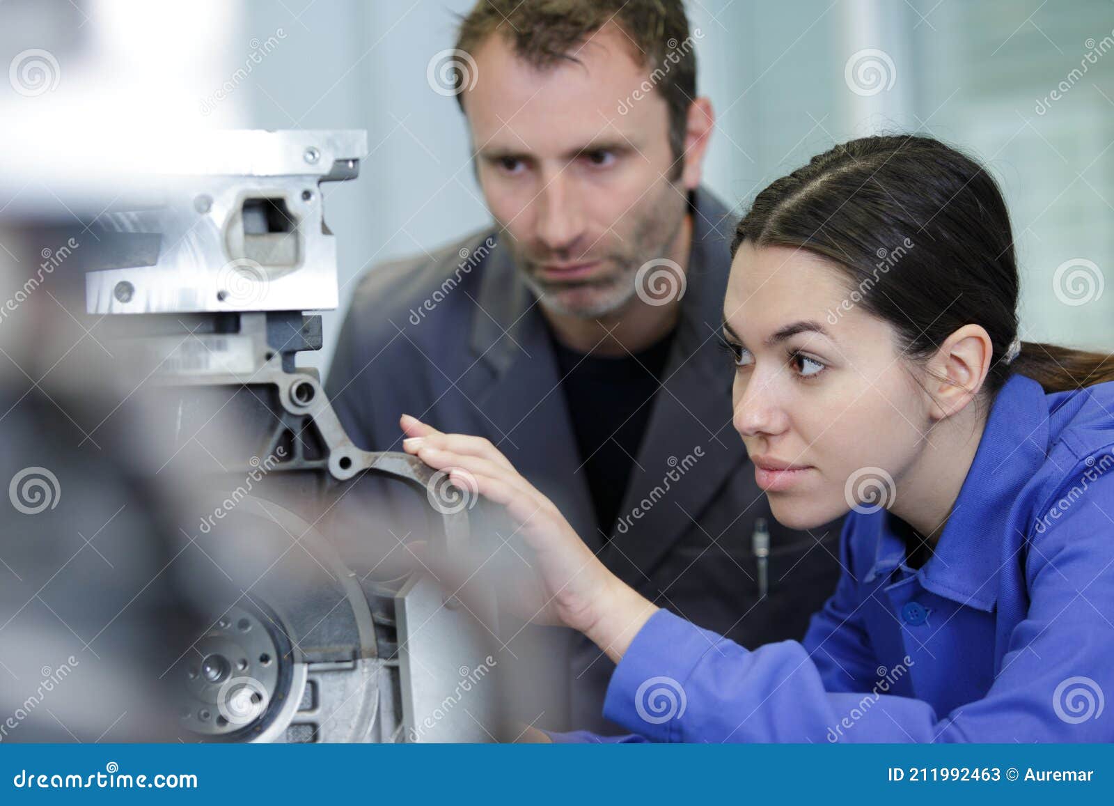 Engineer Showing Equipment To Female Apprentice Stock Image - Image of ...