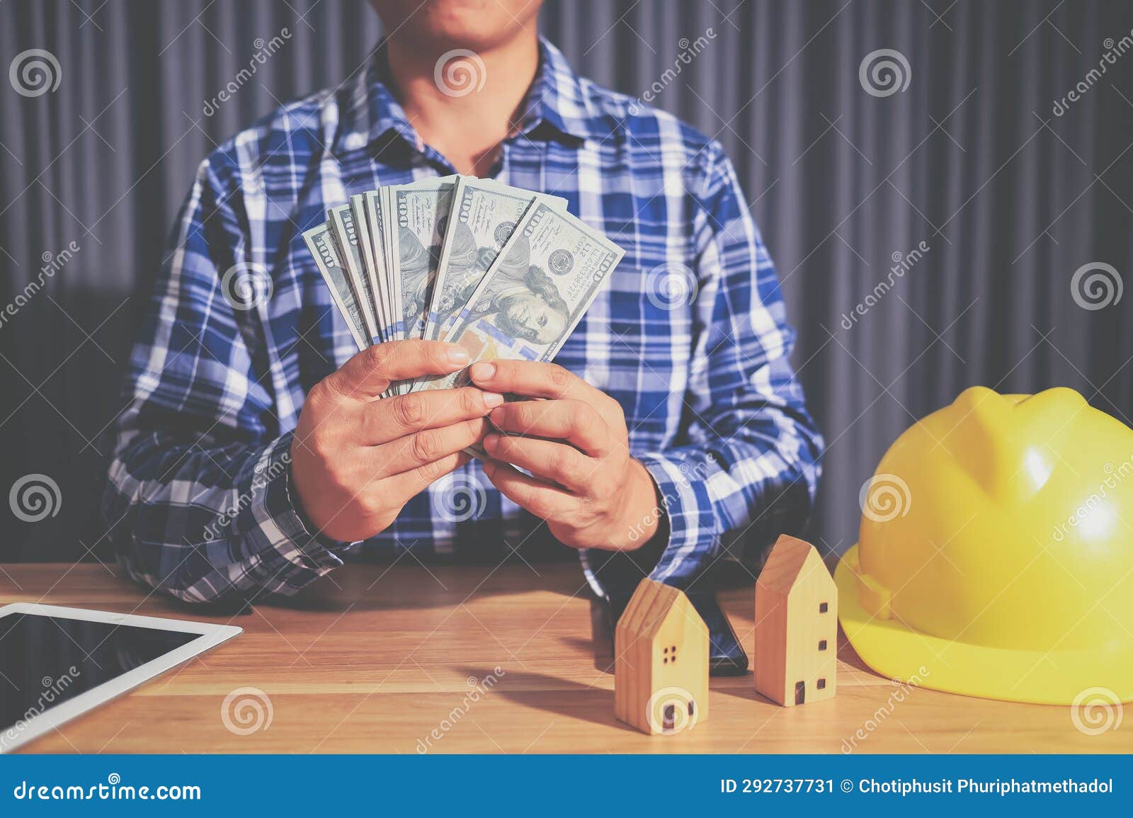 Engineer Sitting and Counting Dollar Bills. Stock Image - Image of data ...
