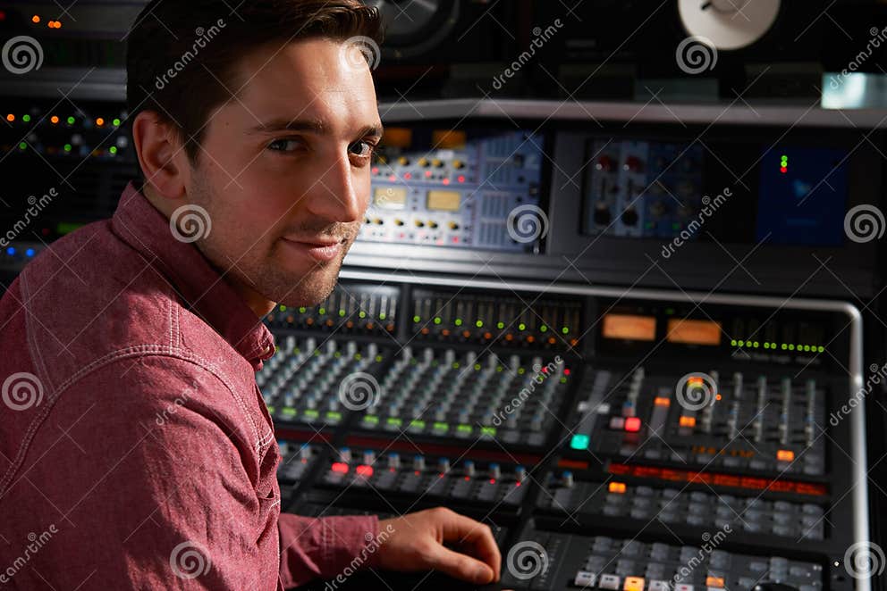 Engineer Sitting at Mixing Desk in Recording Studio Stock Image - Image ...