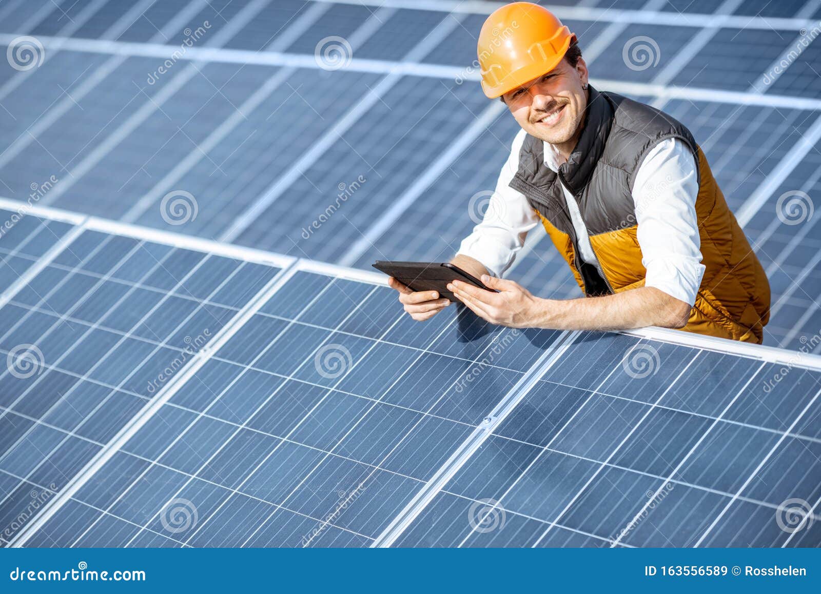 Engineer In Solar Power Plant Working On Installing Solar Panel ; Smart ... Engineer In Solar Power Plant Working On Installing Solar Panel ; Smart ...