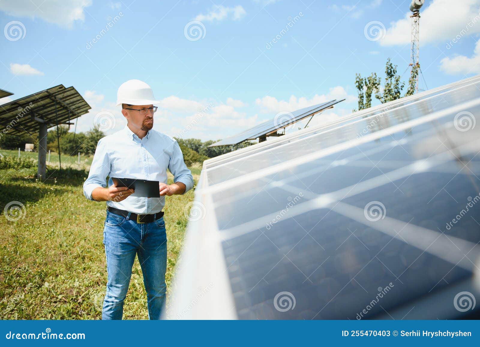 Engineer at Solar Power Station with Solar Panel. Practical Lessons on ...