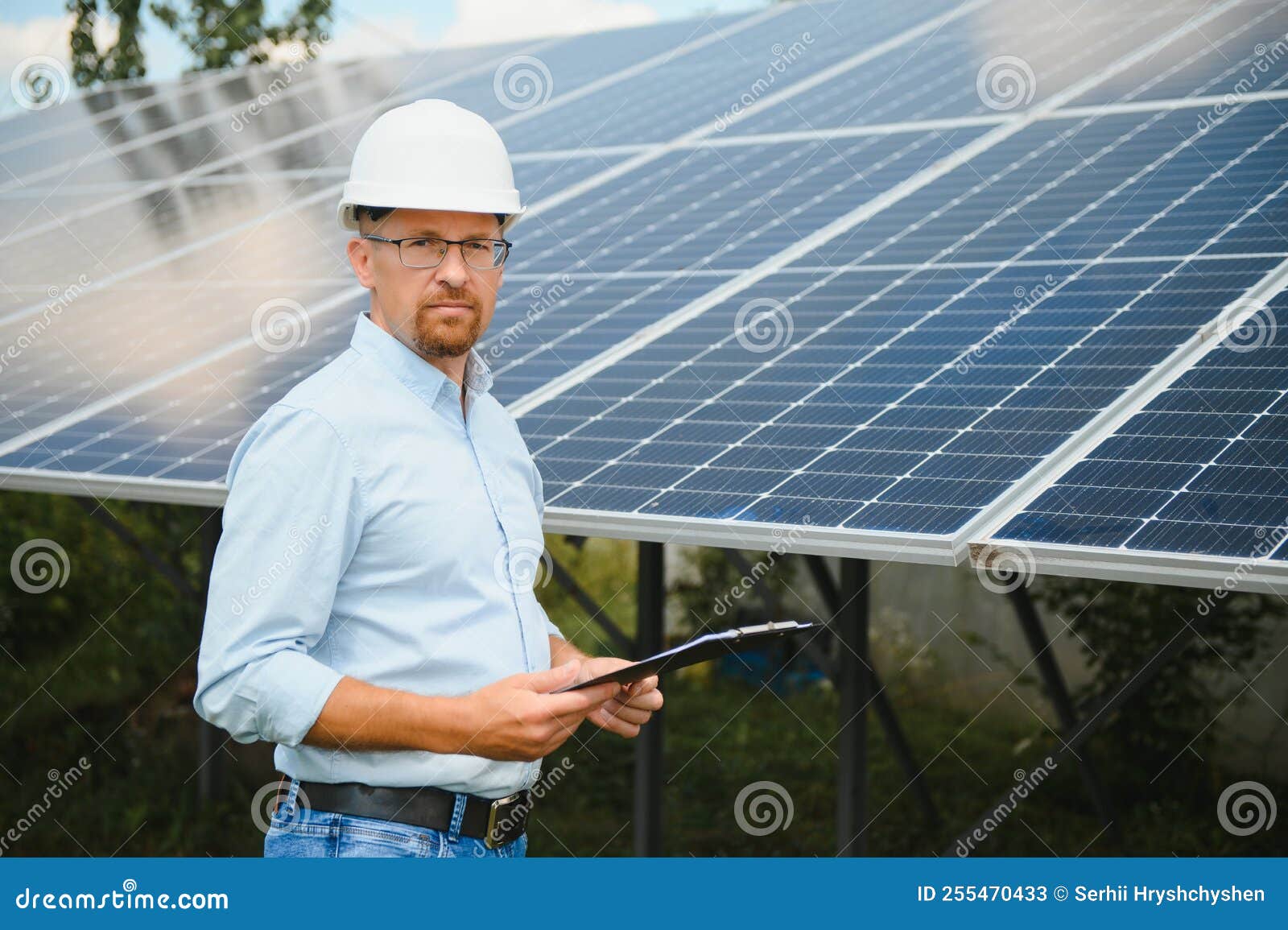 Engineer at Solar Power Station with Solar Panel. Practical Lessons on ...