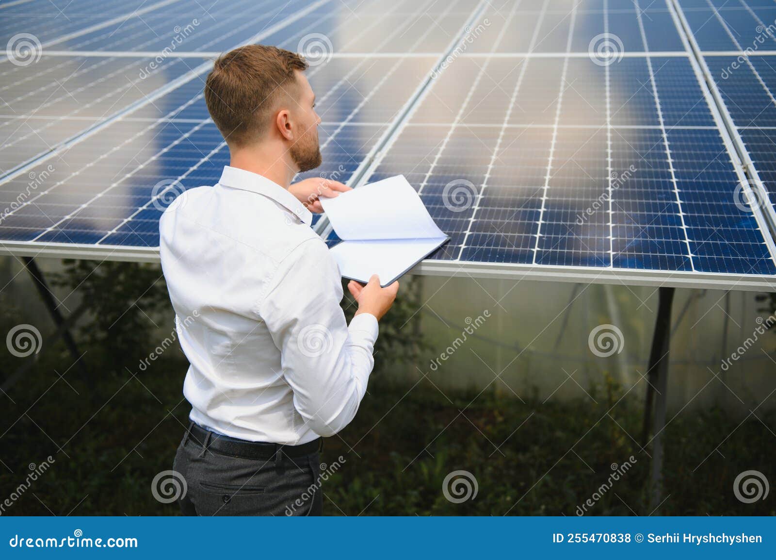 Engineer at Solar Power Station with Solar Panel. Practical Lessons on ...