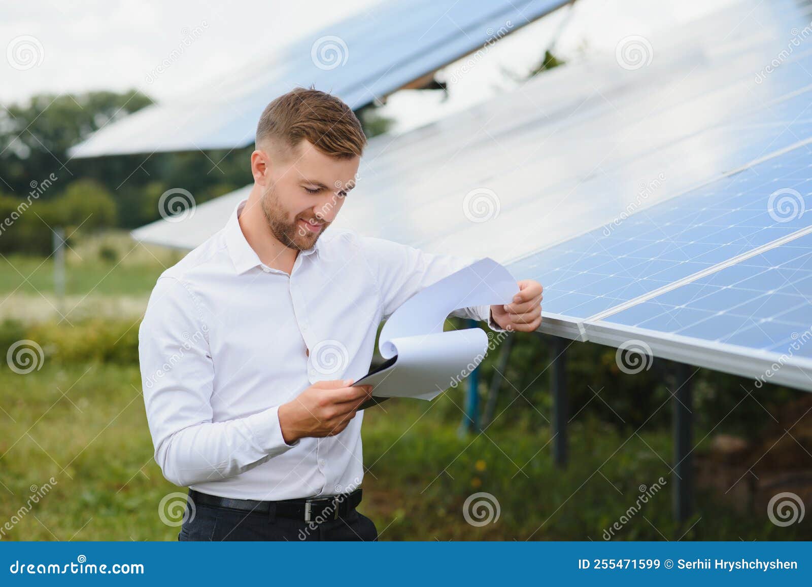 Engineer at Solar Power Station with Solar Panel. Practical Lessons on ...