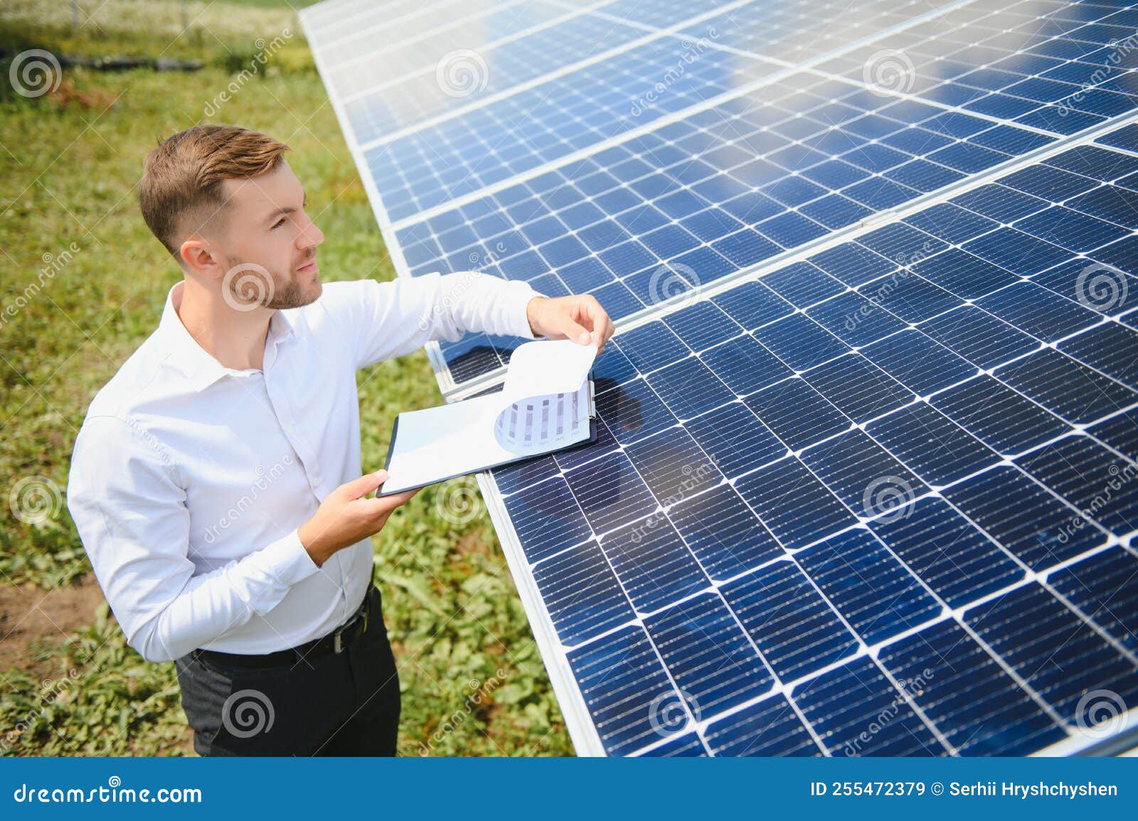 Engineer at Solar Power Station with Solar Panel. Practical Lessons on ...