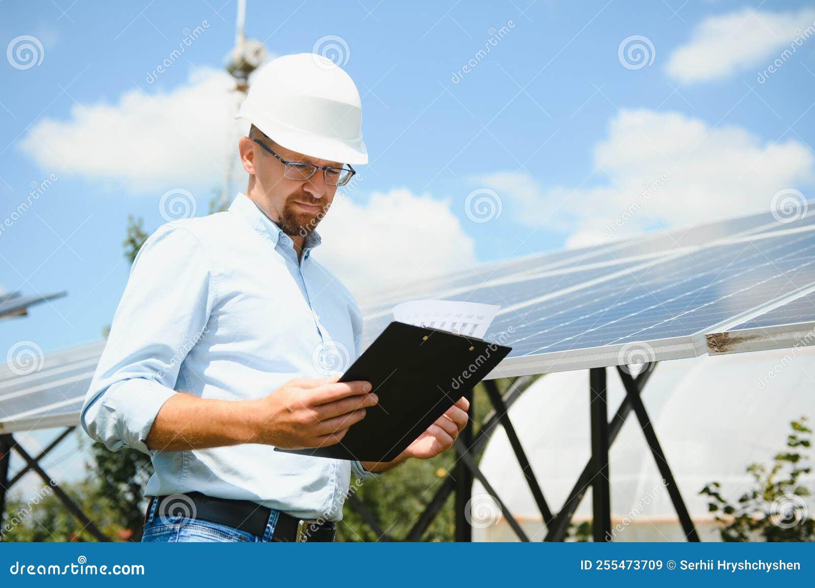 Engineer at Solar Power Station with Solar Panel. Practical Lessons on ...