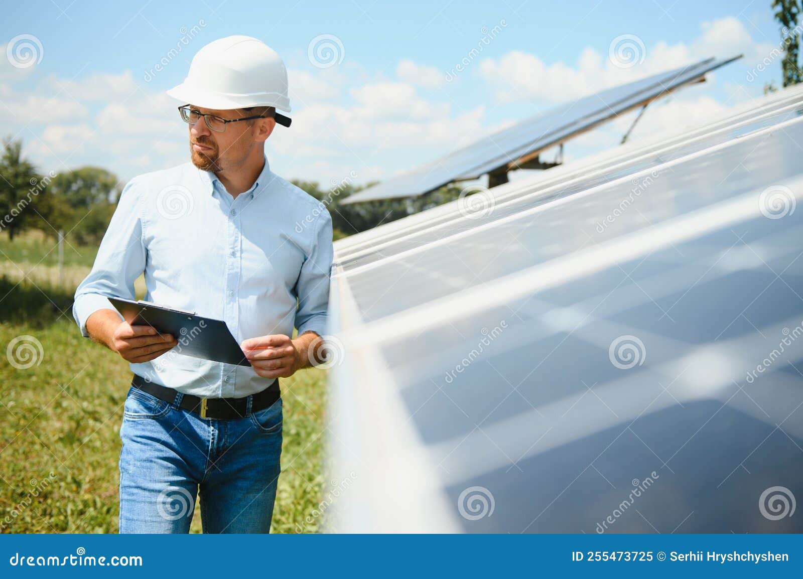 Engineer at Solar Power Station with Solar Panel. Practical Lessons on ...