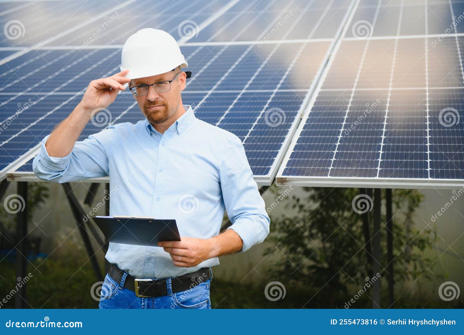 Engineer at Solar Power Station with Solar Panel. Practical Lessons on ...