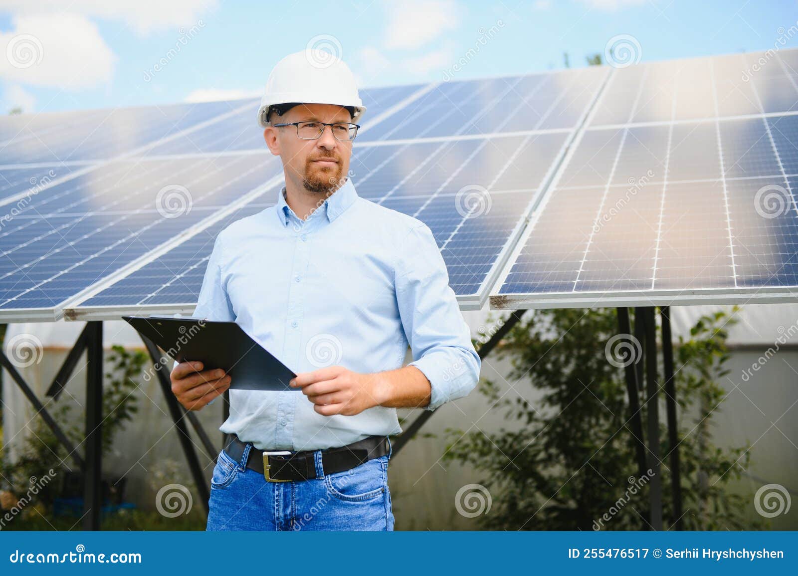 Engineer at Solar Power Station with Solar Panel. Practical Lessons on ...