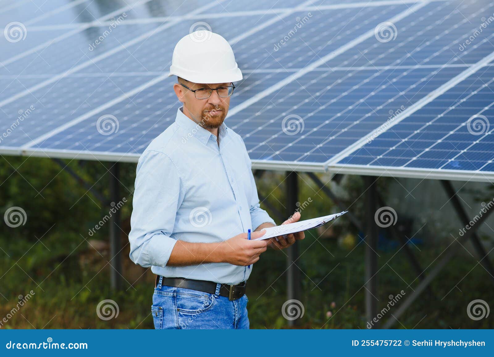Engineer at Solar Power Station with Solar Panel. Practical Lessons on ...