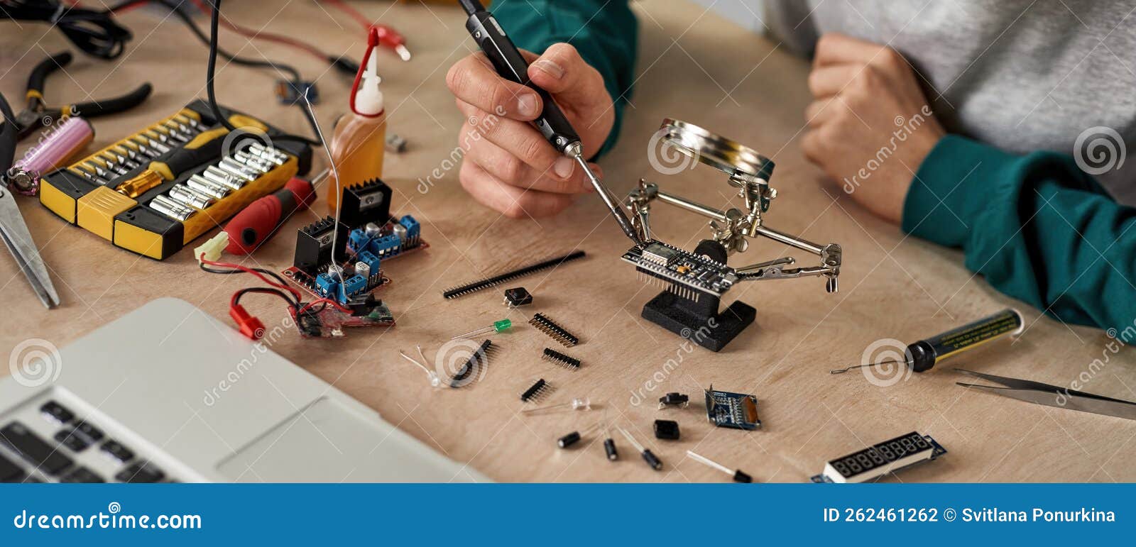 Engineer Soldering Microchip at Table with Laptop Stock Photo - Image ...