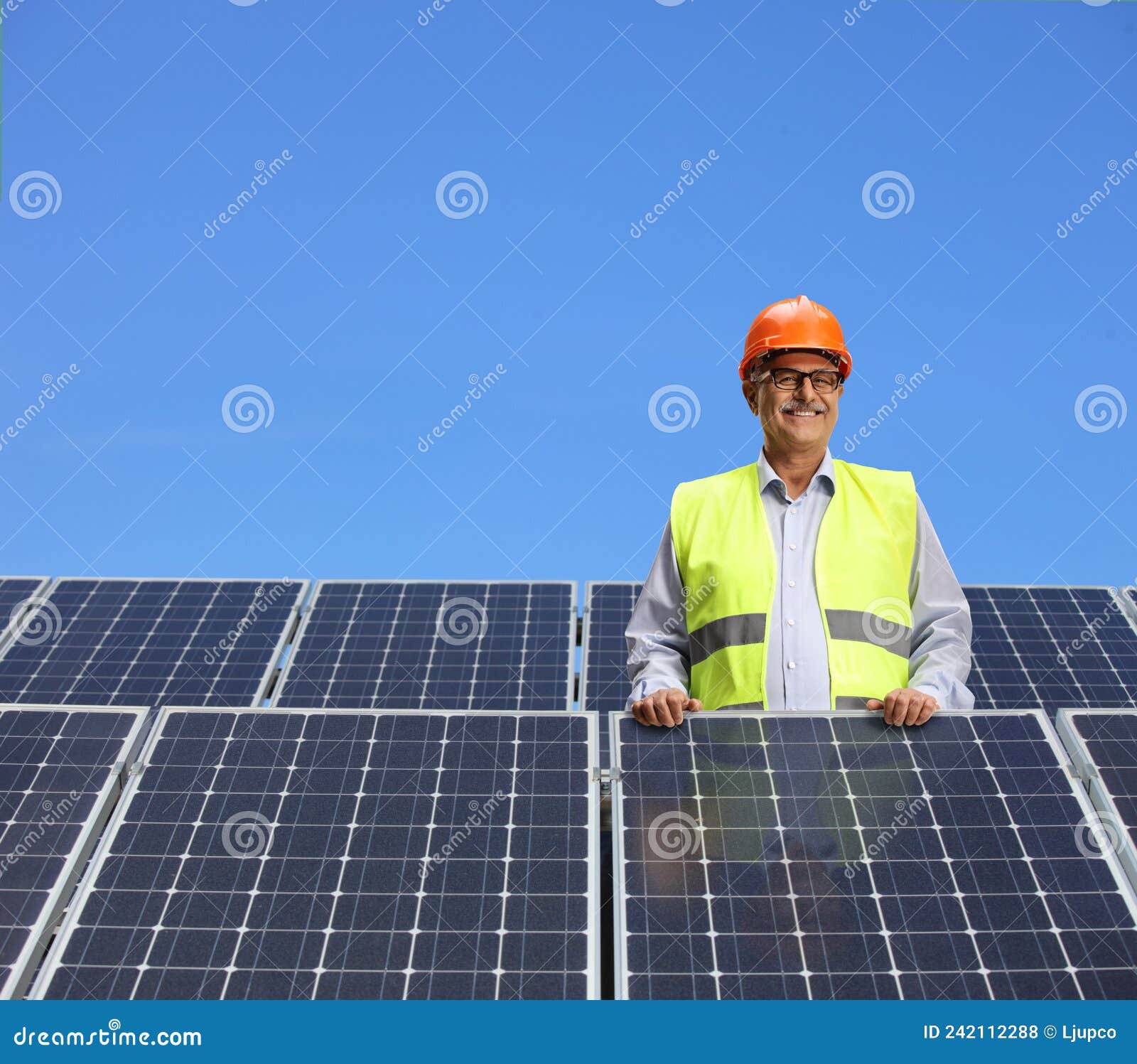 Engineer Standing Behind Solar Panels Stock Photo - Image of male ...