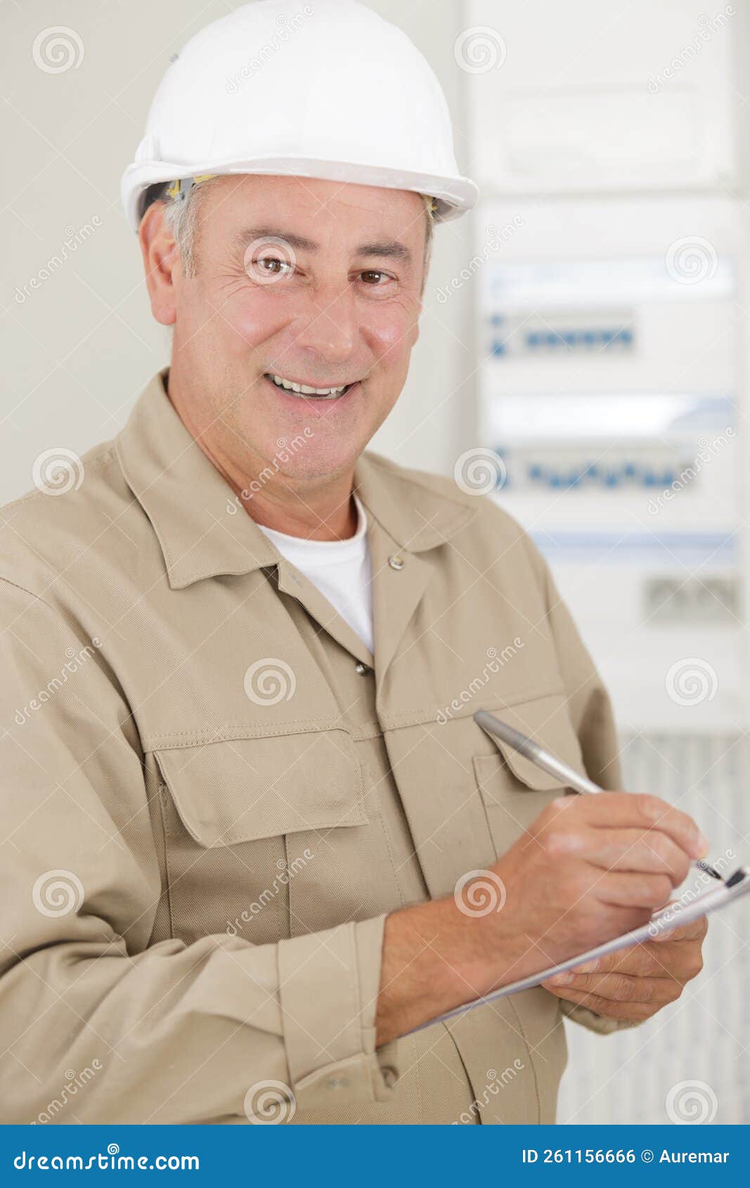 Engineer Standing Holding Clipboard and Smiling Stock Photo - Image of ...