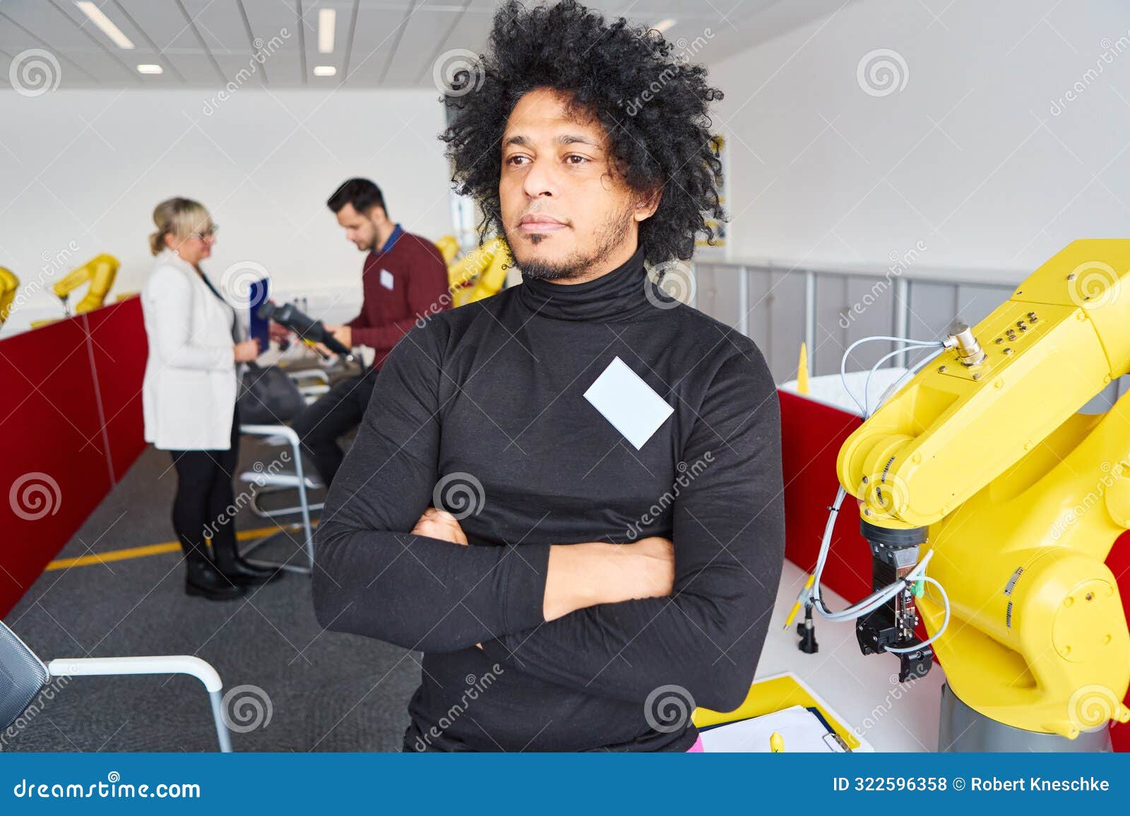 Engineer Standing with Robotic Arm in Laboratory Setting Stock Photo ...