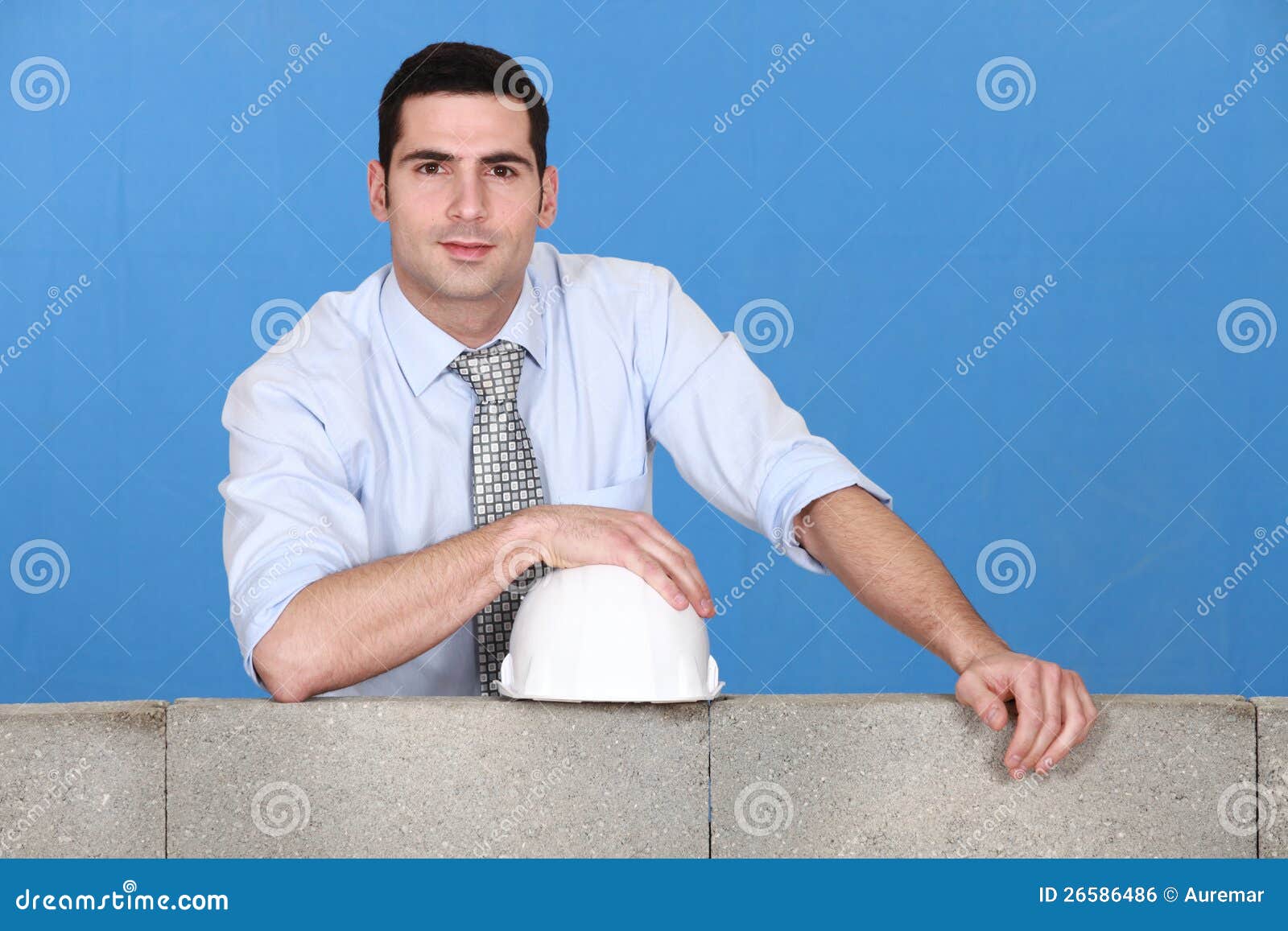 Engineer standing by wall stock photo. Image of activity - 26586486