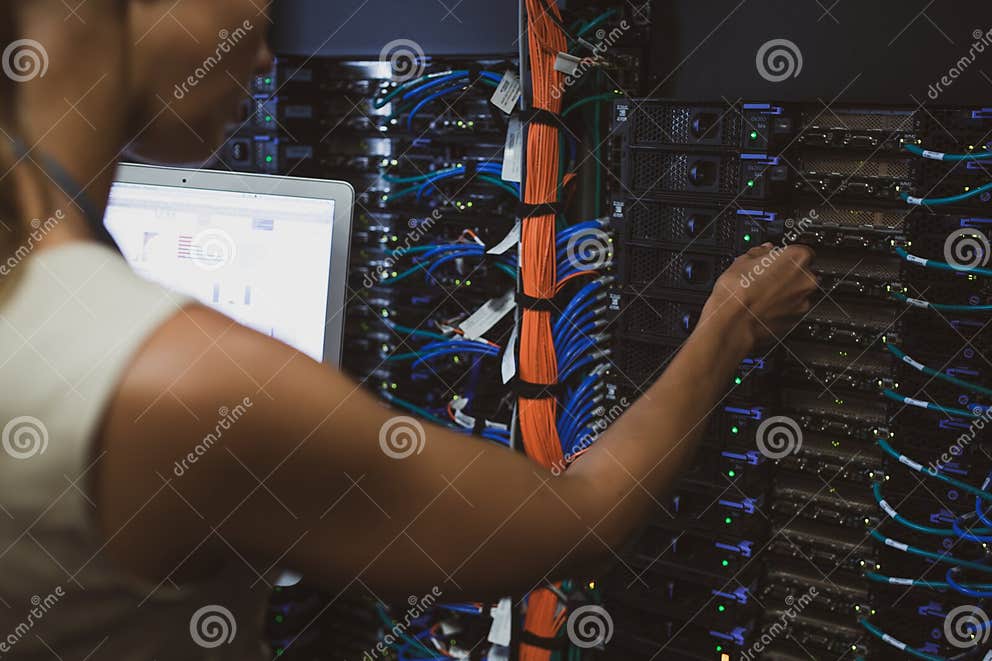 It Engineer Standing before Working Server Rack Doing Diagnostics Using ...