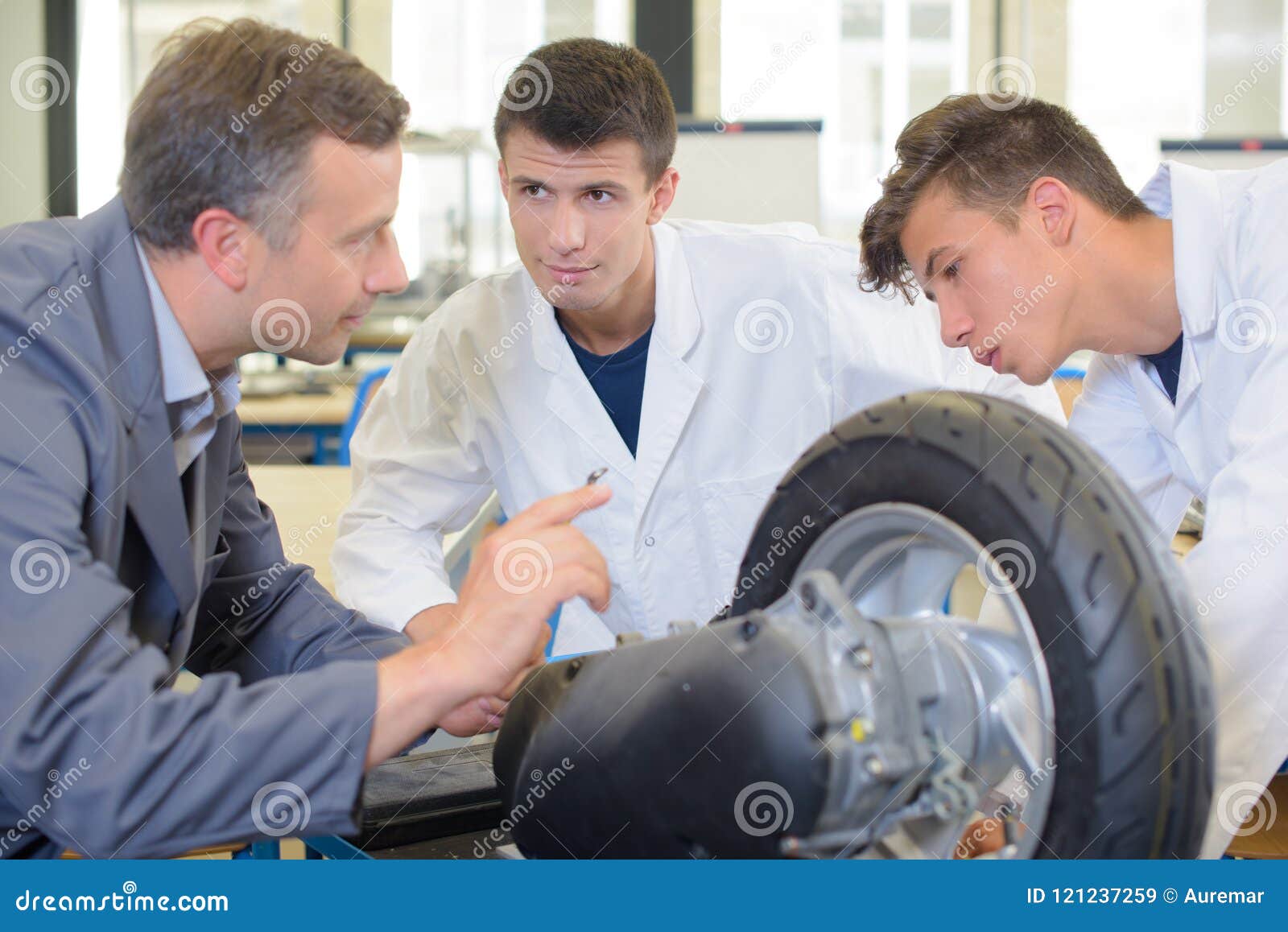 Engineer and Students Looking at Wheel Stock Image - Image of warning ...