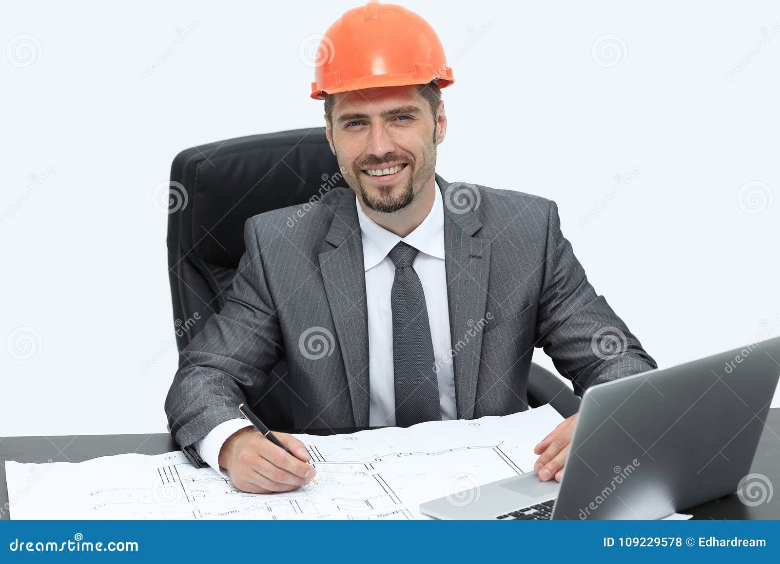 Engineer is Studying the Draft,sitting Behind a Desk Stock Photo ...