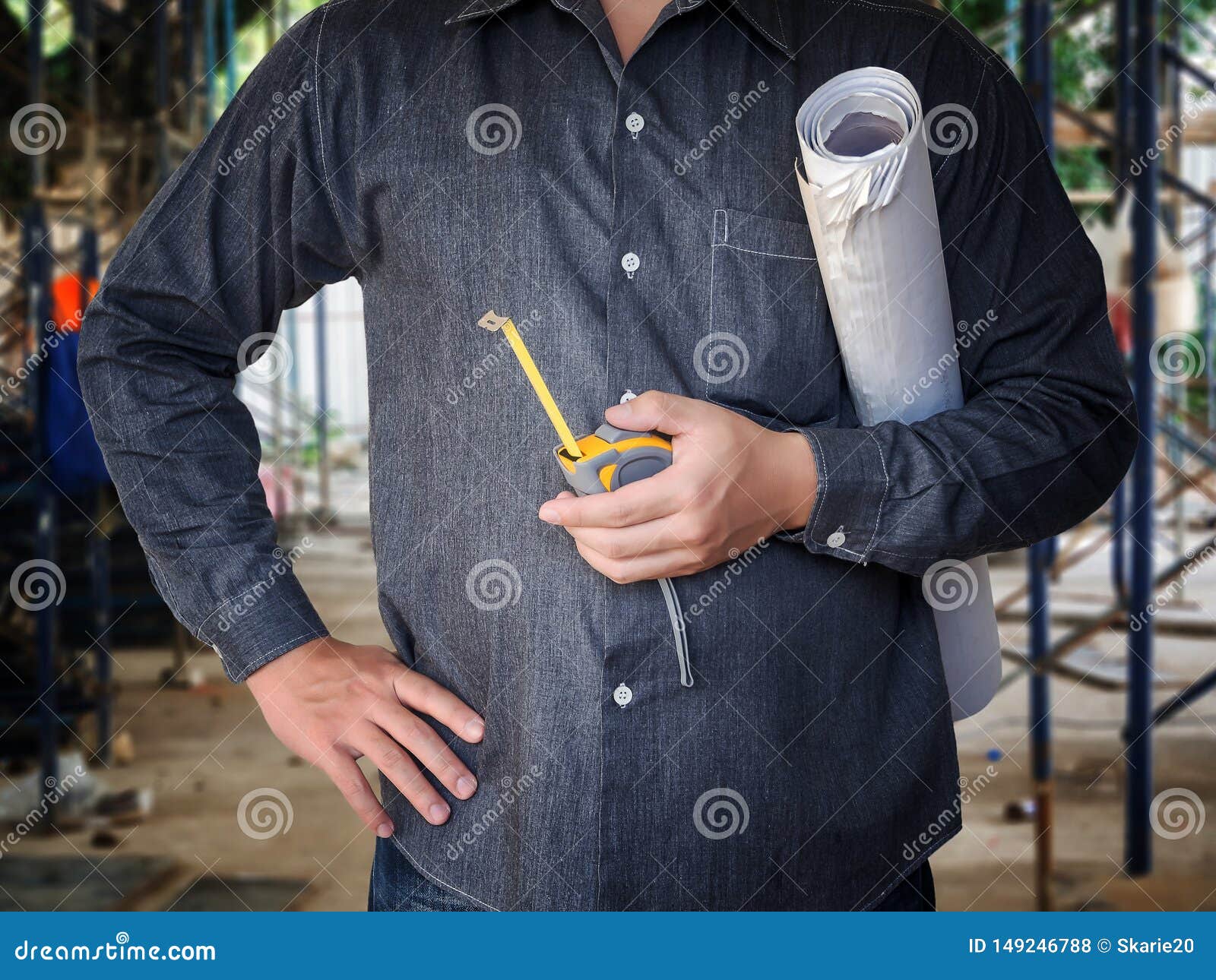 Engineer in Suit with Blueprint and Helmet in Construction Site Stock ...