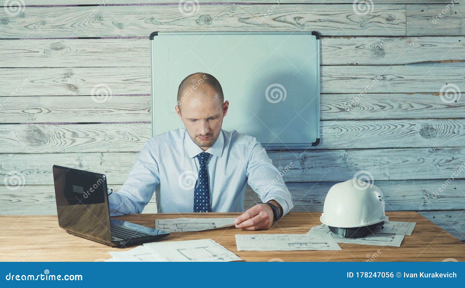 Engineer Supervisor Working on Drawings in the Office. Stock Photo ...