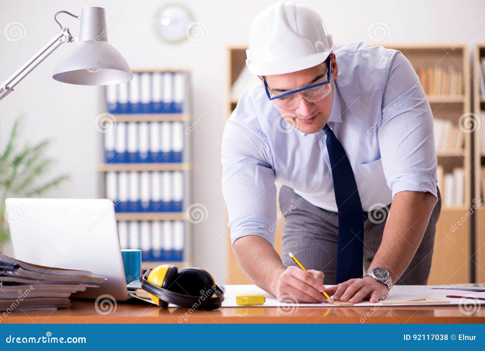 The Engineer Supervisor Working on Drawings in the Office Stock Photo ...