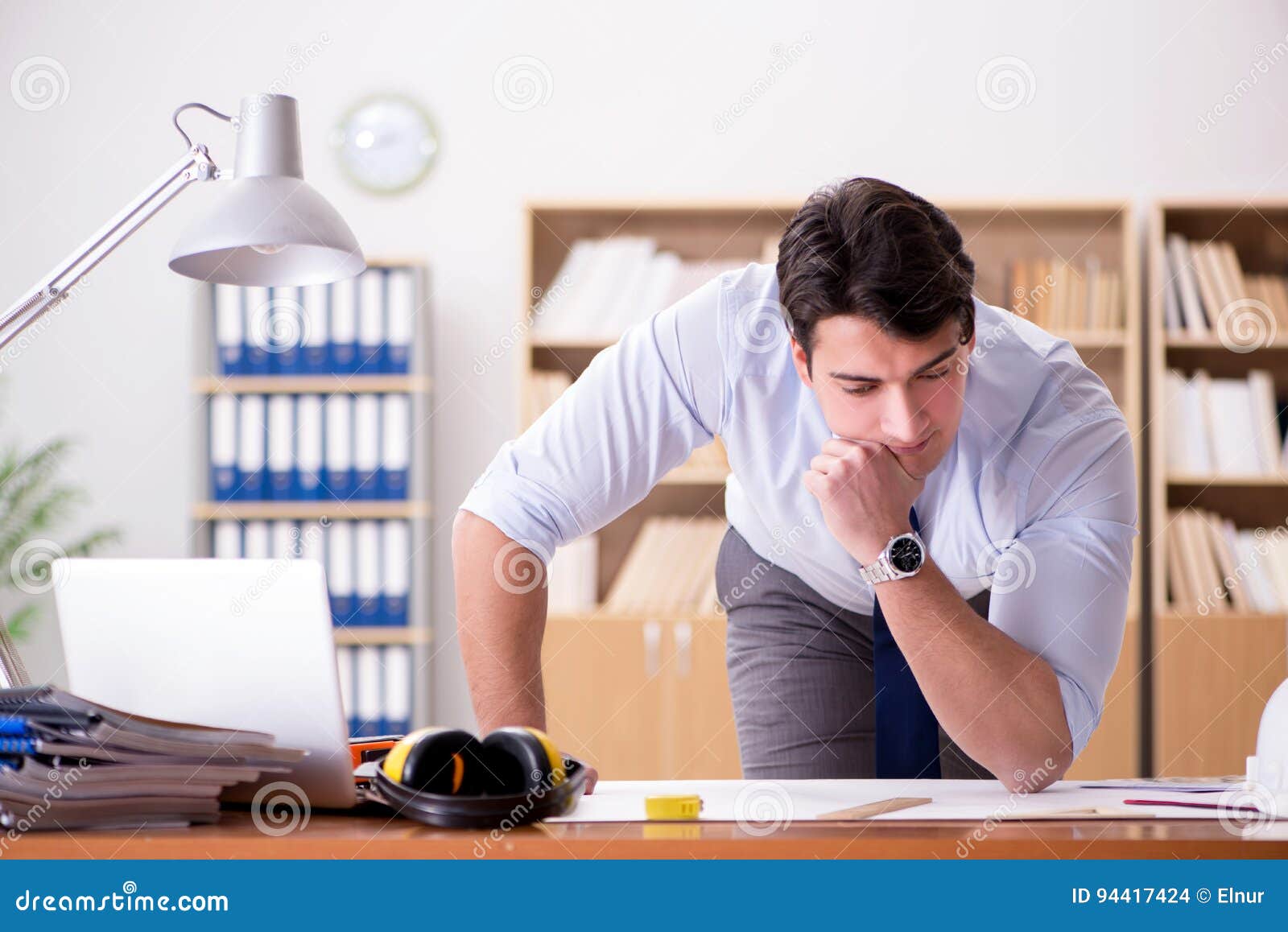 The Engineer Supervisor Working on Drawings in the Office Stock Photo ...