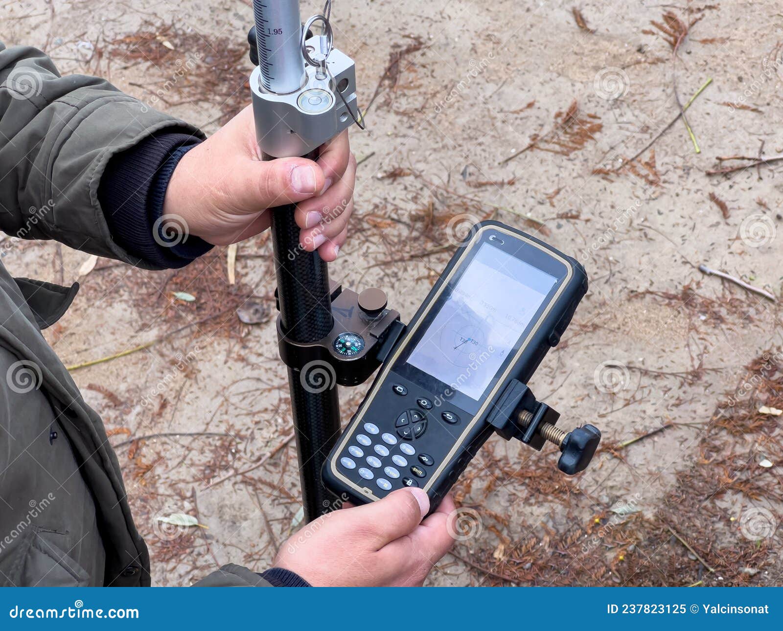 Engineer and Surveyor Reviewing the GPS System and Total Station Data ...