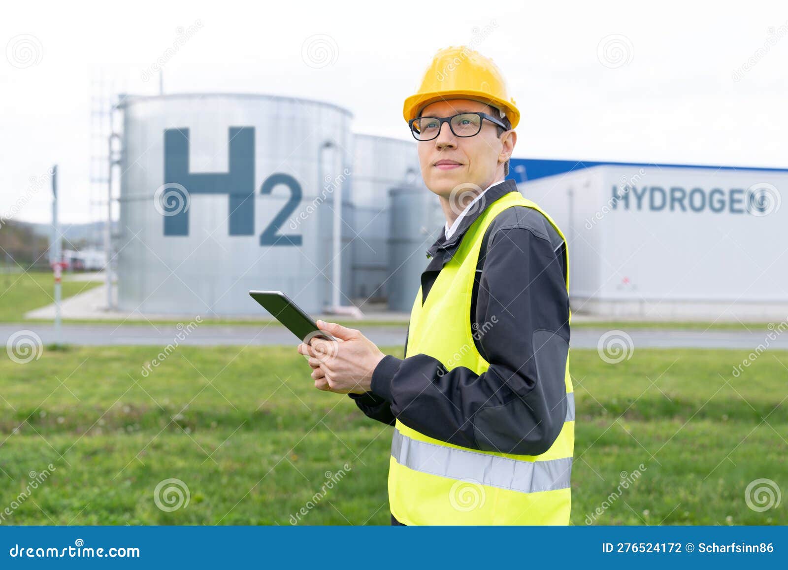 Engineer with Tablet Computer on a Background of Hydrogen Factory Stock ...