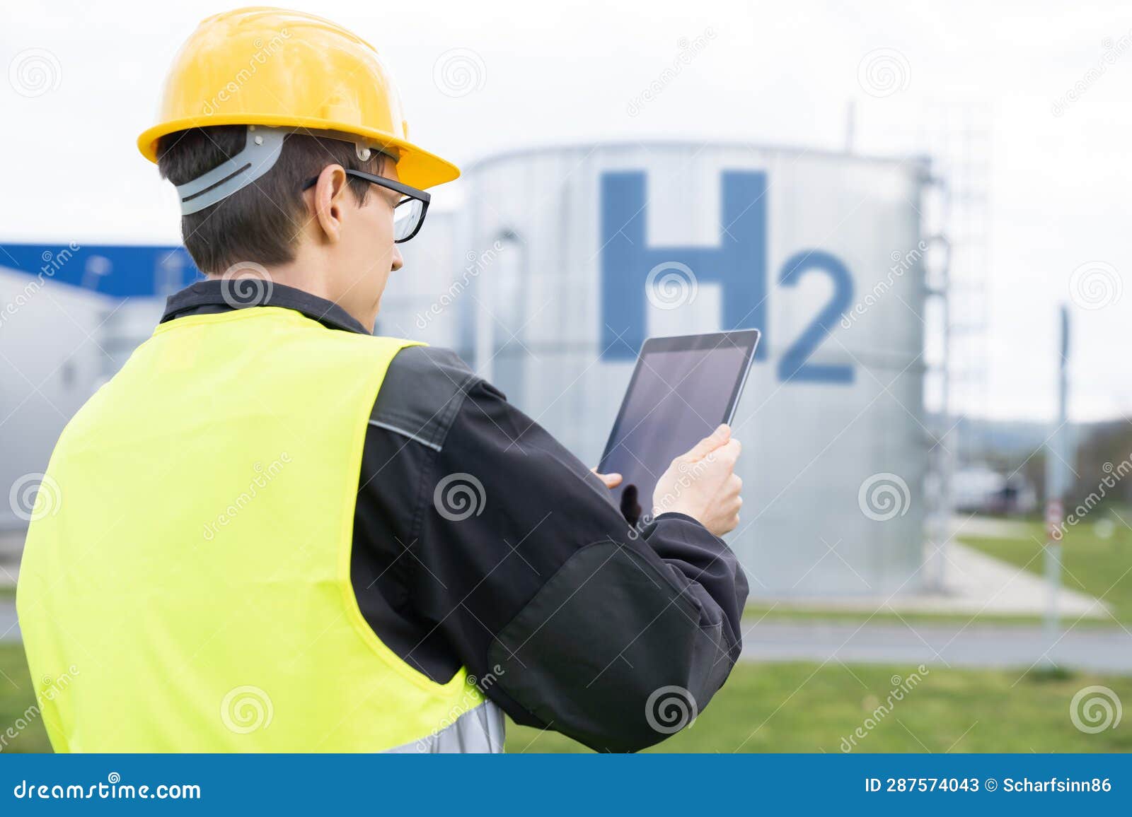 Engineer with Tablet Computer on a Background of Hydrogen Factory Stock ...