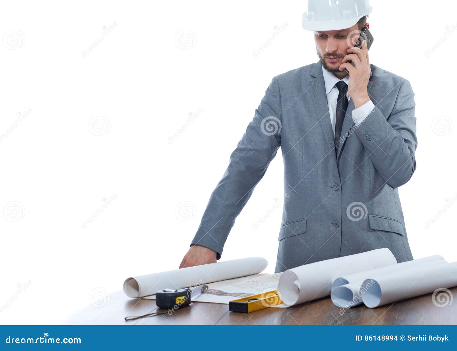 Engineer Talking on Call Phone about Architecture Planing. Stock Photo ...