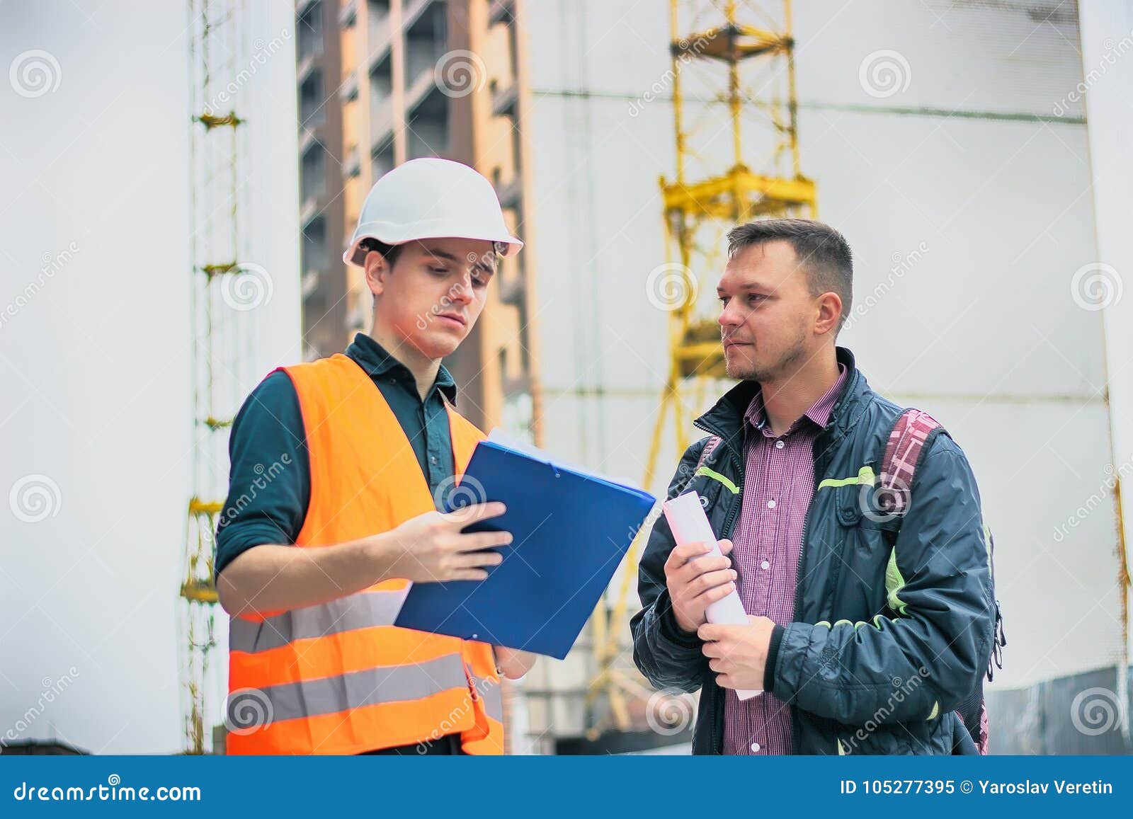 Engineer Talking Discussing with Architect Working with Blueprints for ...