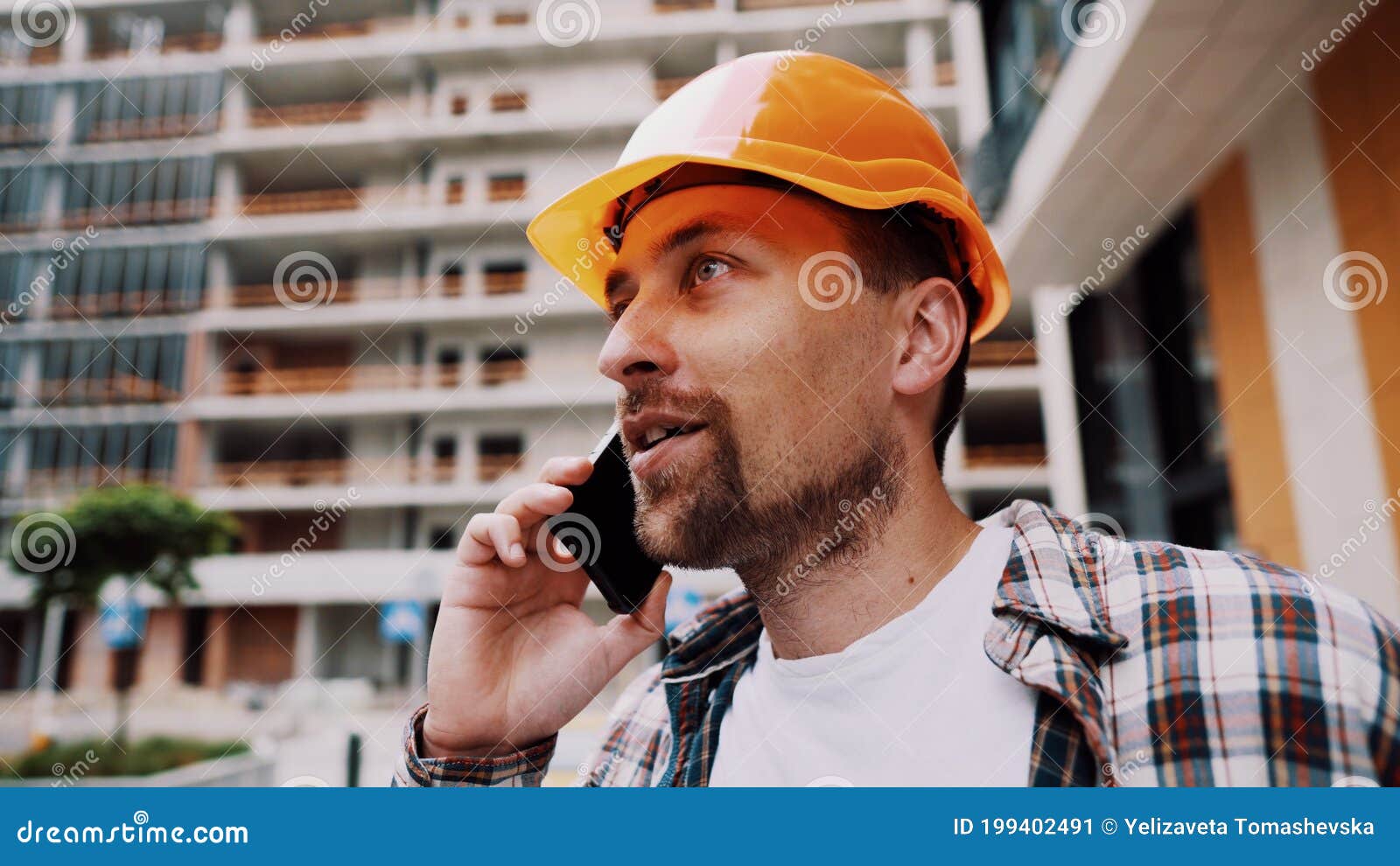 Engineer Talking on Phone. Architect Using Phone on Construction Site ...