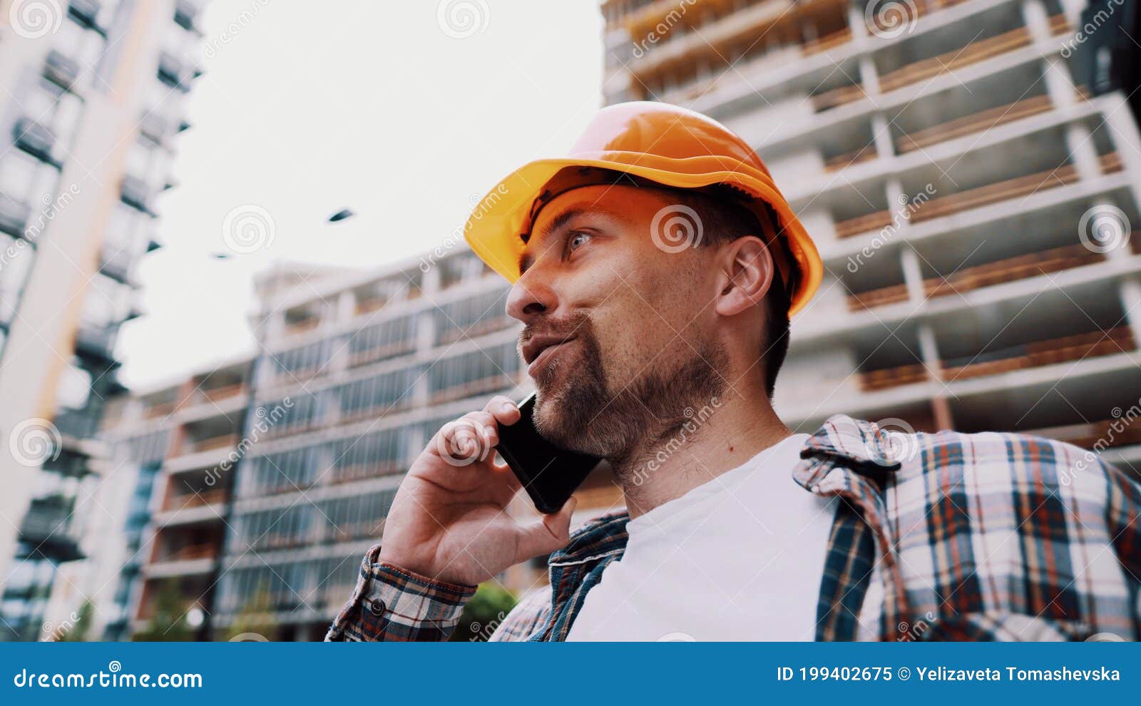 Engineer Talking on Phone. Architect Using Phone on Construction Site ...