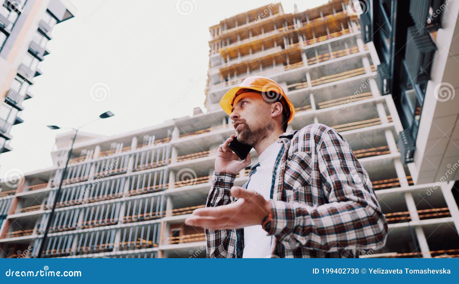 Engineer Talking on Phone. Architect Using Phone on Construction Site ...