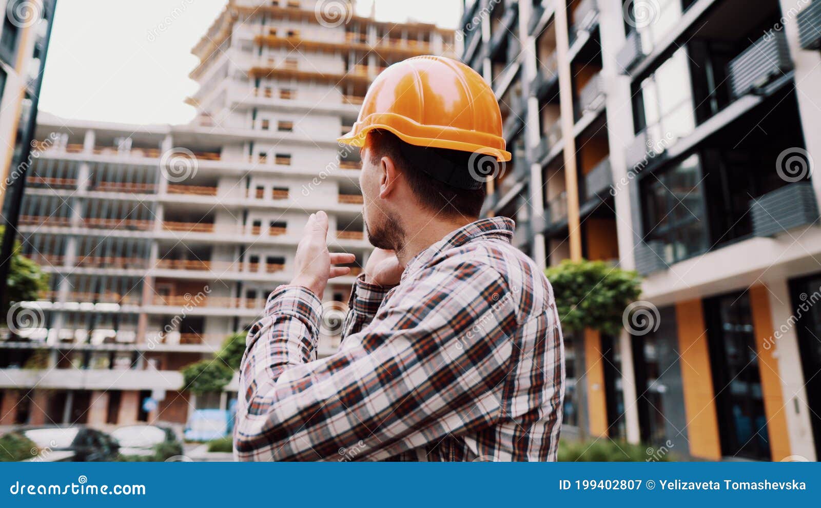 Engineer Talking on Phone. Architect Using Phone on Construction Site ...