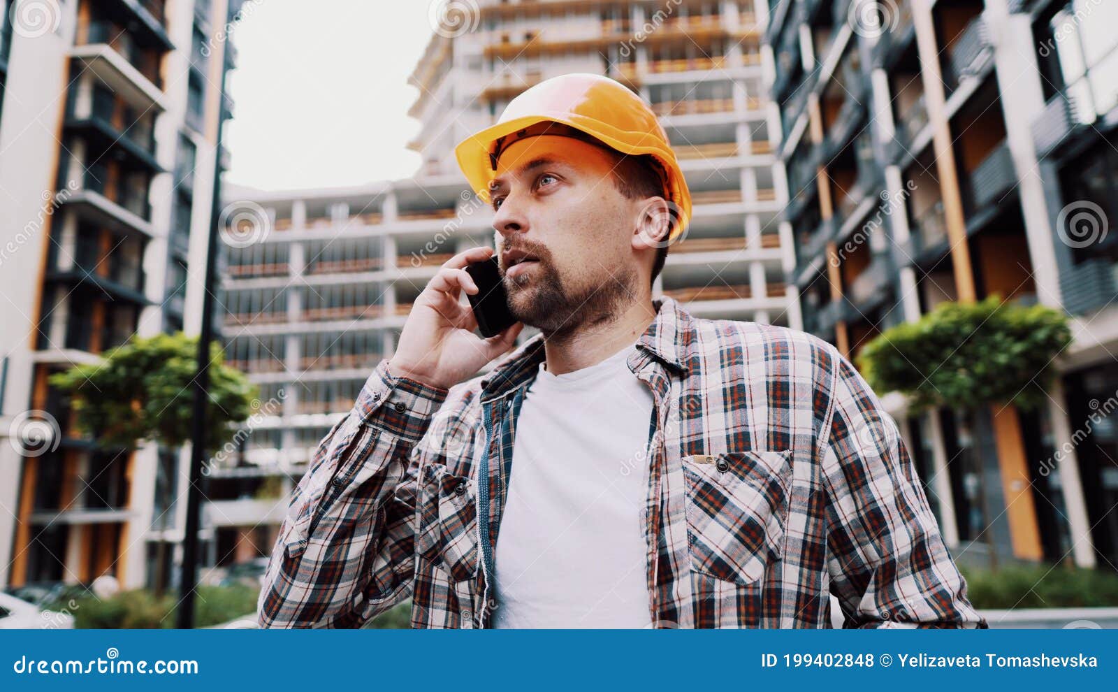 Engineer Talking on Phone. Architect Using Phone on Construction Site ...