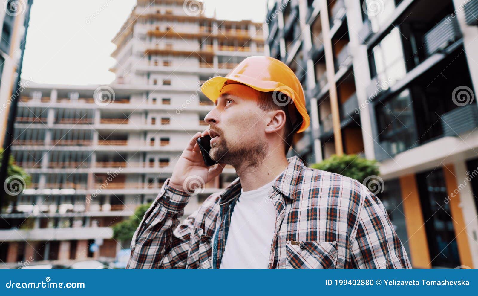 Engineer Talking on Phone. Architect Using Phone on Construction Site ...