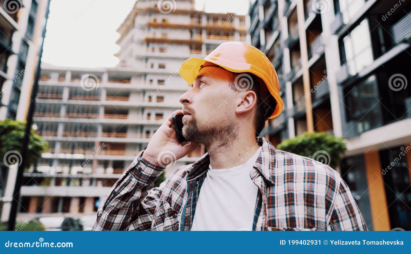 Engineer Talking on Phone. Architect Using Phone on Construction Site ...