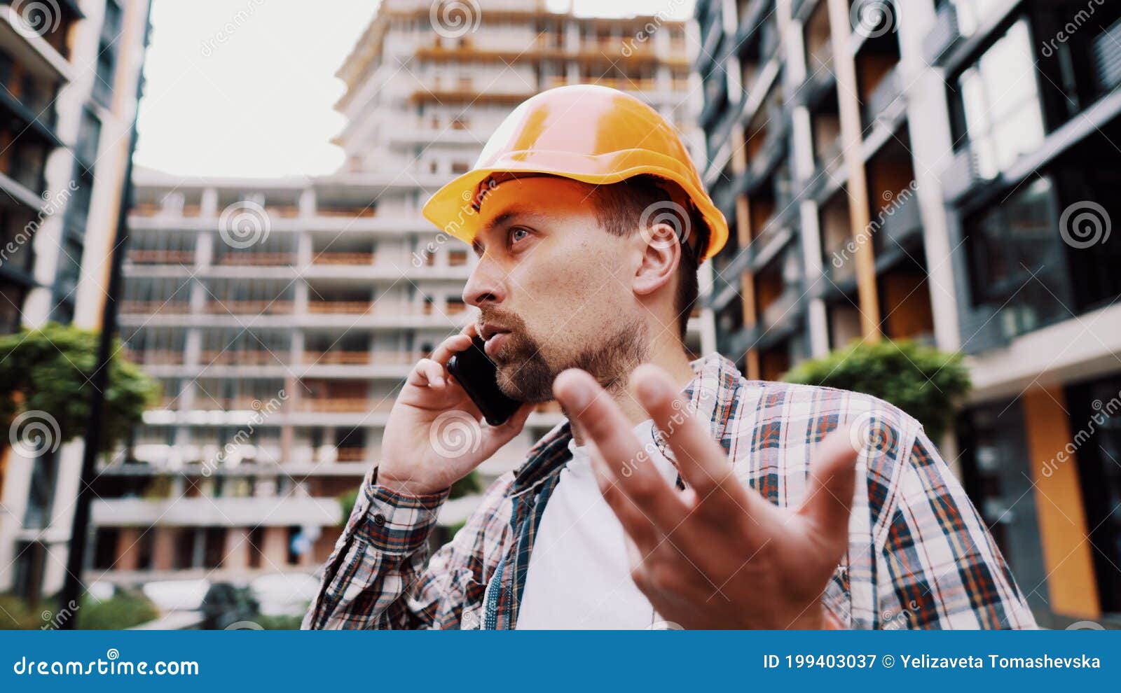 Engineer Talking on Phone. Architect Using Phone on Construction Site ...