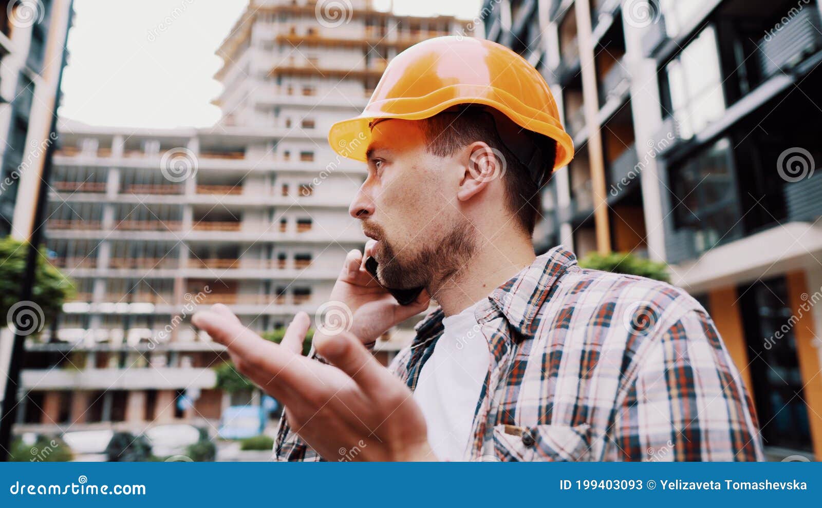 Engineer Talking on Phone. Architect Using Phone on Construction Site ...