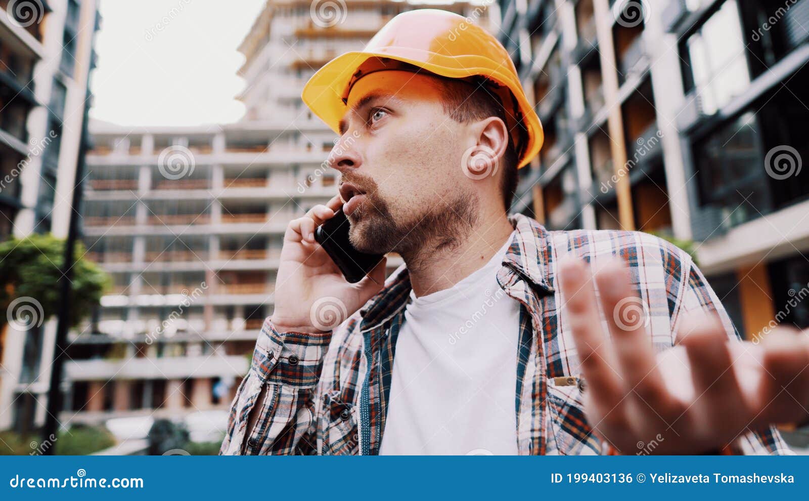 Engineer Talking on Phone. Architect Using Phone on Construction Site ...
